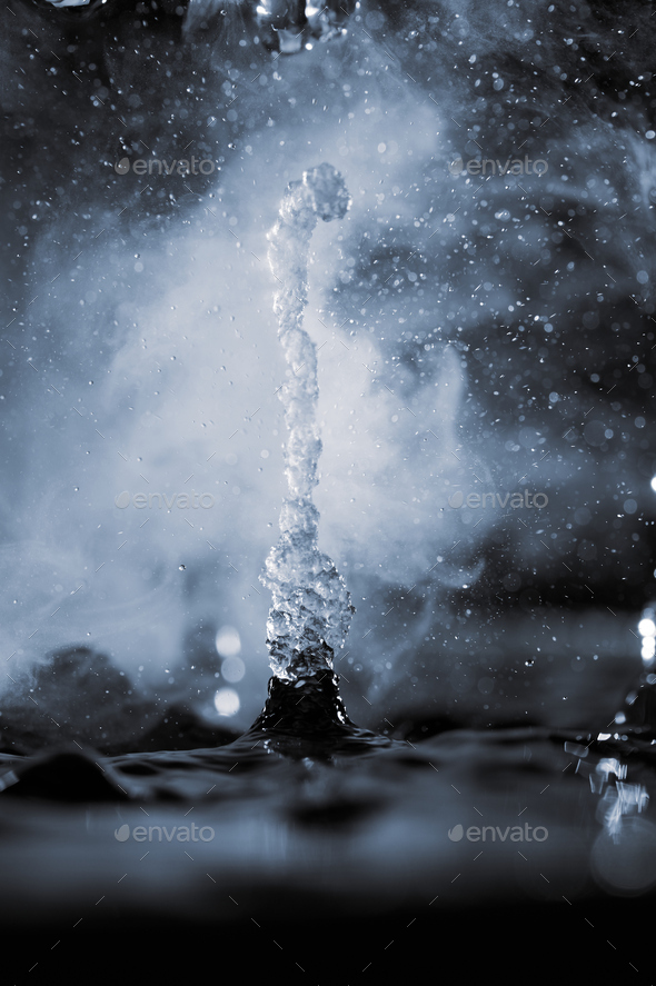 Boiling water splash with steam on black background closeup Stock Photo ...