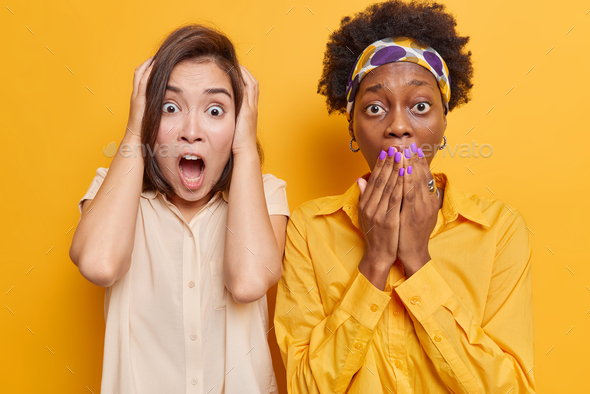 Human reactions concept. Terrified multiethnic young women stare with ...
