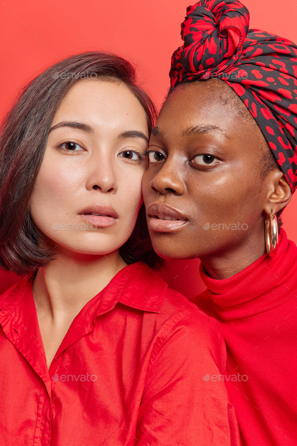 Close up shot of two women have different color of skin specific ...