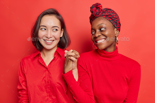 Friendship sign. Happy women shake hands together being best fiends ...