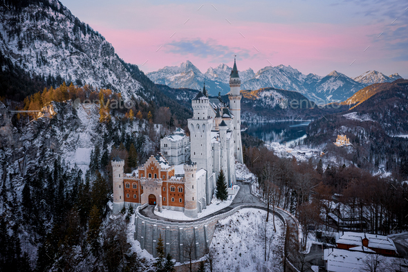 Scenic shot of the Neuschwanstein Castle in Germany surrounded by snowy ...
