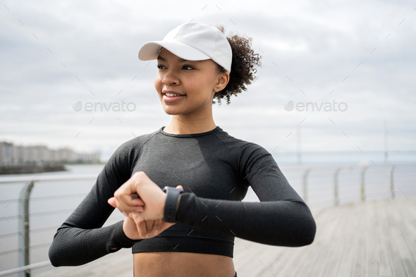 Fitness watch on the arm, pulse and calories. Woman training on the ...