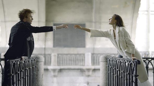 Couple reaches out to each other. Action. Romantic couple reach out ...