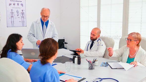 Expert doctor talking about medical technology with medical staff Stock ...