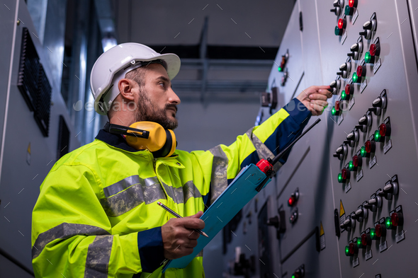 engineer checking and inspecting at MDB panel working with electric ...