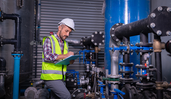 Engineer under checking the industry cooling tower air conditioner is ...