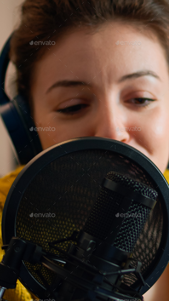 Influencer talking on professional microphone recording vlog Stock ...