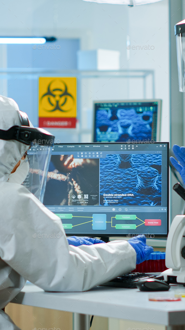 Chemist woman in ppe suit typing on pc checking virus development Stock ...