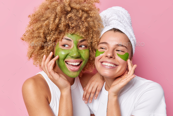 Photo of happy two women touch face enjoy softness of skin undergo ...