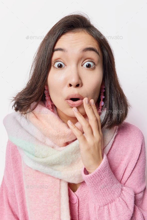 Surprised scared young Asian woman with dark hair stares bugged eyes ...