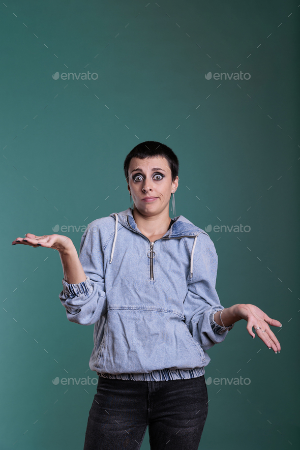 Portrait of confused brunette woman with short hair posing on isolated ...