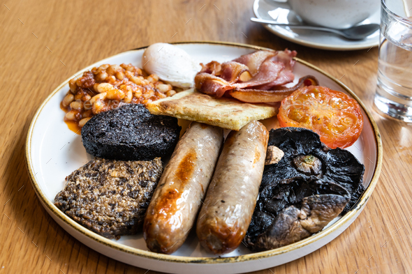 Traditional Scottish breakfast with haggis, ham, sausages, mushroom ...