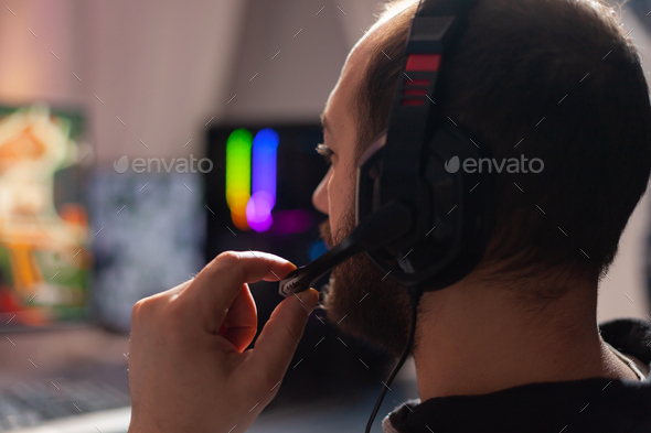 Close up portrait of pro esport player talking on headset Stock Photo ...