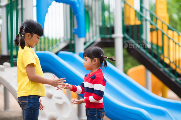 Two girls friends playing rock paper scissors hand game. Caucasian ...