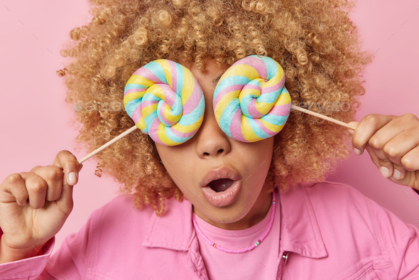 Headshot of surprised unrecognizable curly haired woman covers eyes ...