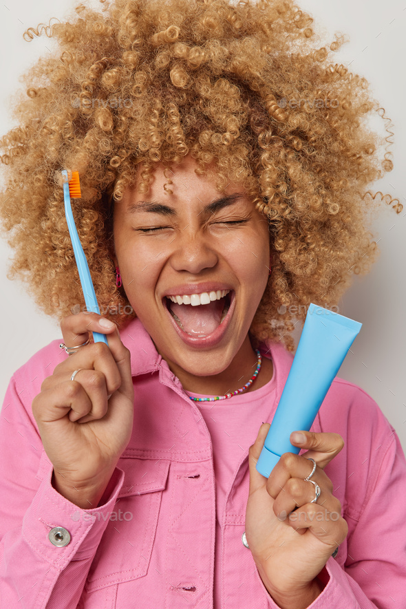 Personal oral hygiene concept. Positive woman exclaims from joy going ...