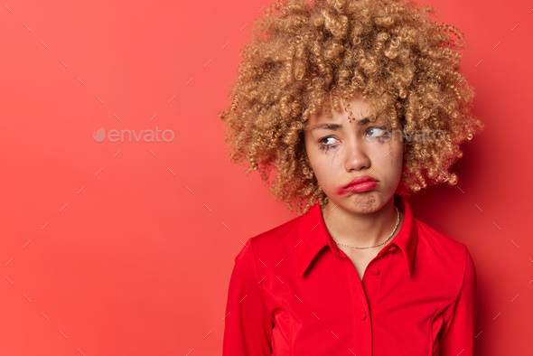 Sorrowful upset woman looks upset away frowns face has leaked makeup ... Sorrowful upset woman looks upset away frowns face has leaked makeup ...