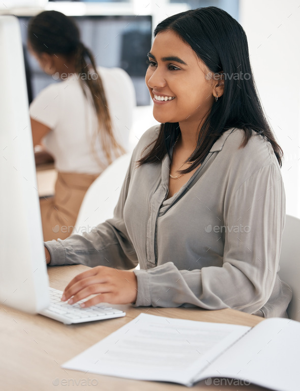 Computer, report and typing with an indian woman in business working on ...