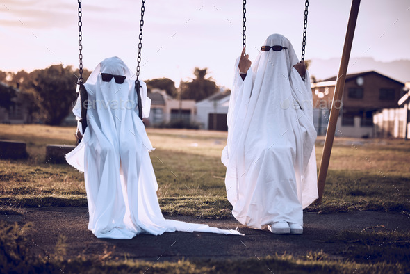 Park, halloween and friends in a ghost costume in a kids playground in ...