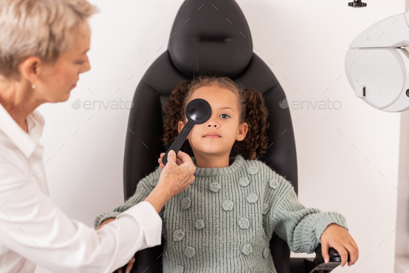 Eye test, child and optometrist testing eye sight for glasses ...