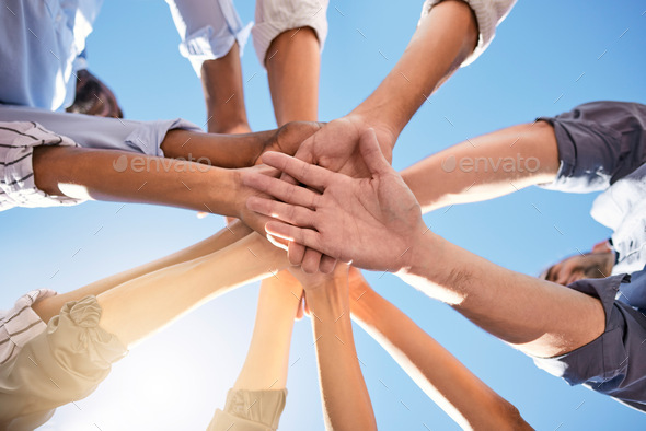 Low angle, hands and circle in success, solidarity or support team building, teamwork ...