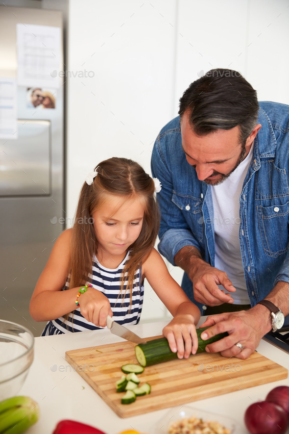 Like a pro chef already. Shot of an adorable little girl cooking with ...