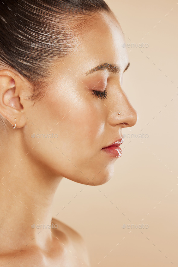 Face, beauty and skincare with a model woman profile posing in studio ...