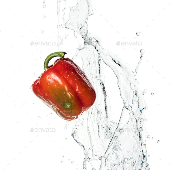 whole tasty fresh red bell pepper with water splash and drops isolated ...