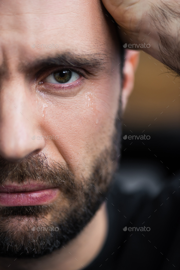 partial view of crying man with tears on face looking at camera Stock ...