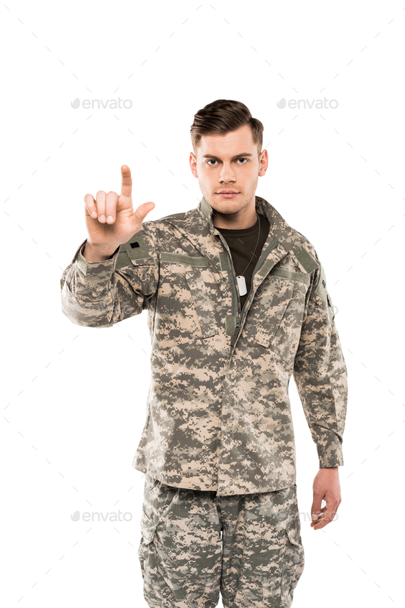serious soldier in uniform pointing with finger isolated on white Stock ...