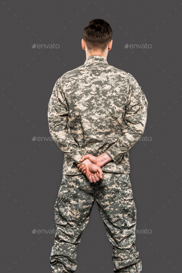 back view of soldier standing isolated on grey Stock Photo by ...