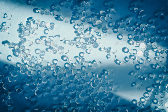 Texture image of many diamonds in blue water illuminated by sunlight as ...