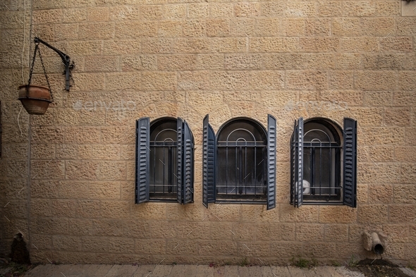 tree open windows in an Old City Jerusalem, Israel Stock Photo by wirestock