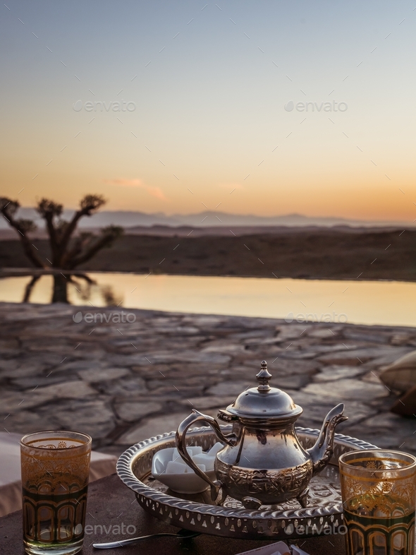 Vertical closeup shot of a typical Moroccan mint tea set on the table ...