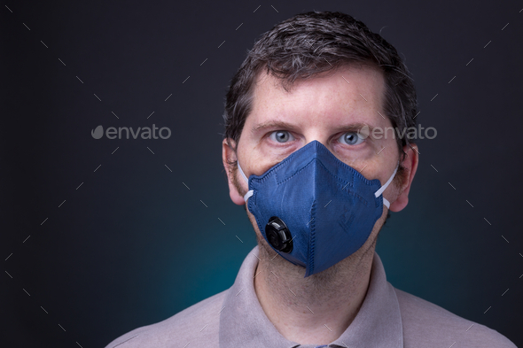 Caucasian male with dark blue N95 respirator face mask. Stock Photo by ...