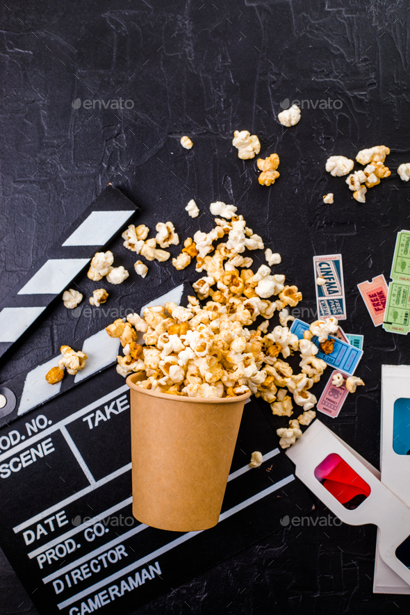 Cinema minimal concept. popcorn, 3d glasses clapper board on black ...