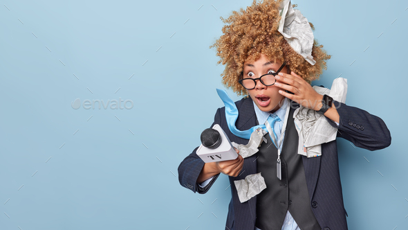 Shocked female news correspondent reports international events stares ...