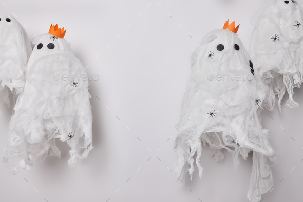 Spooky ghosts with crowns on heads and spiders isolated over grey ...