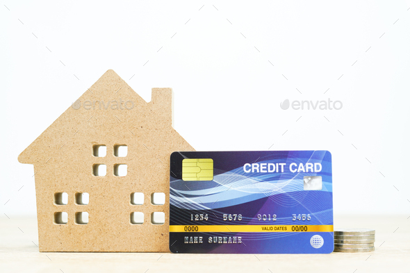House model and credit card on table Stock Photo by stoonn | PhotoDune