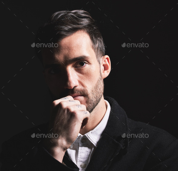 Man, idea and thinking face, fashion and portrait against a black ...