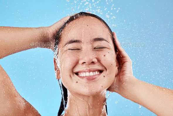 Woman, shower and smile for skincare hygiene, wash or cleanse against a ...