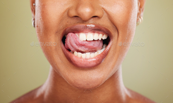 Tongue, teeth and african woman in closeup with lick, smile or happy ...