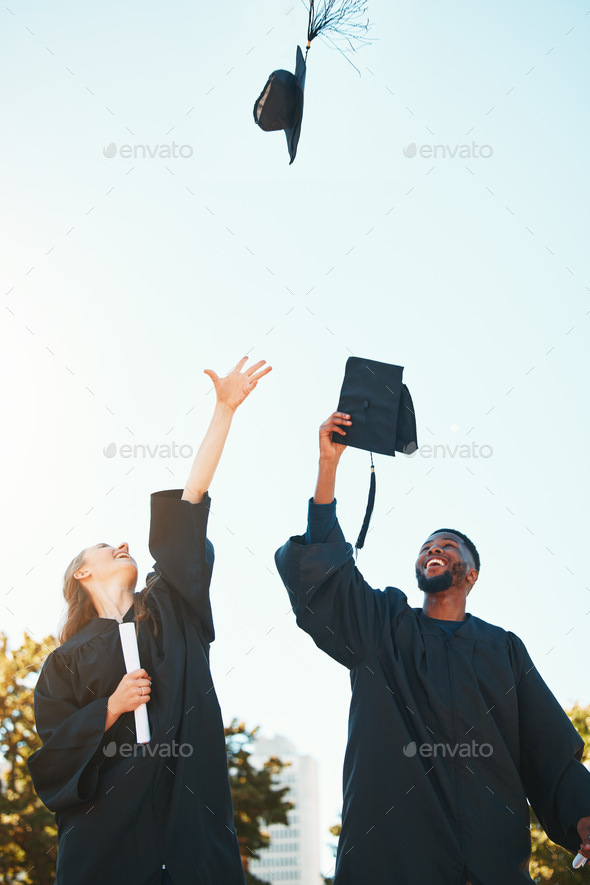University, graduation and students with graduation cap in air for ...