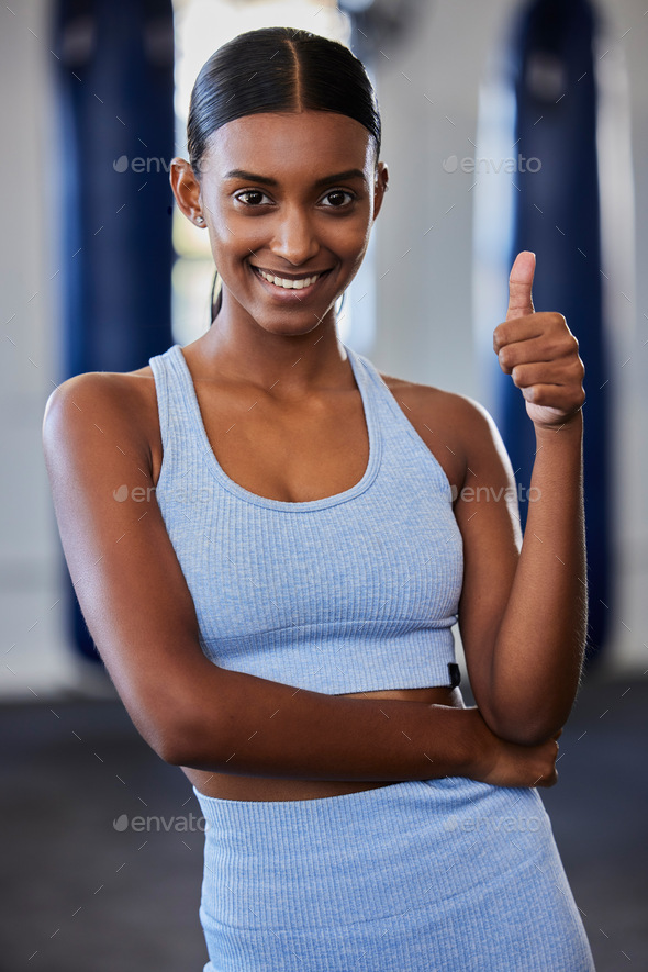Thumbs up, Indian woman and fitness, wellness and exercise health model ...