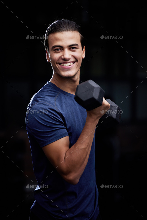 Bodybuilder man, studio portrait and weightlifting with smile for ...