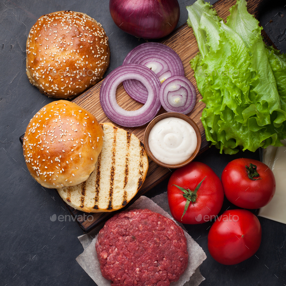 Hamburger Building Kit. Fresh ingredients for Burger on dark stone ...