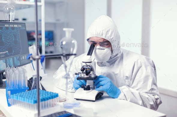 Analyzing virus in microbiology lab using microscope Stock Photo by DC ...