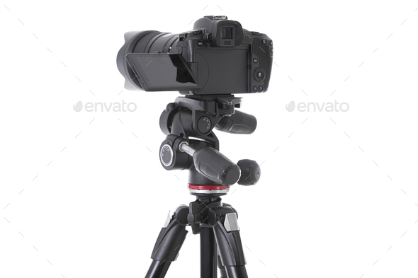 Backside view of modern multifunctional black camera on trepied ...