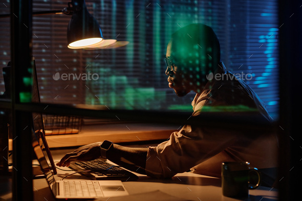Programmer working overtime in office Stock Photo by AnnaStills | PhotoDune