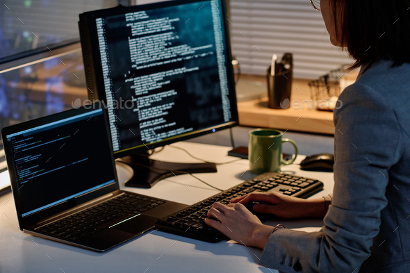 Programmer working with security codes on computer Stock Photo by AnnaStills